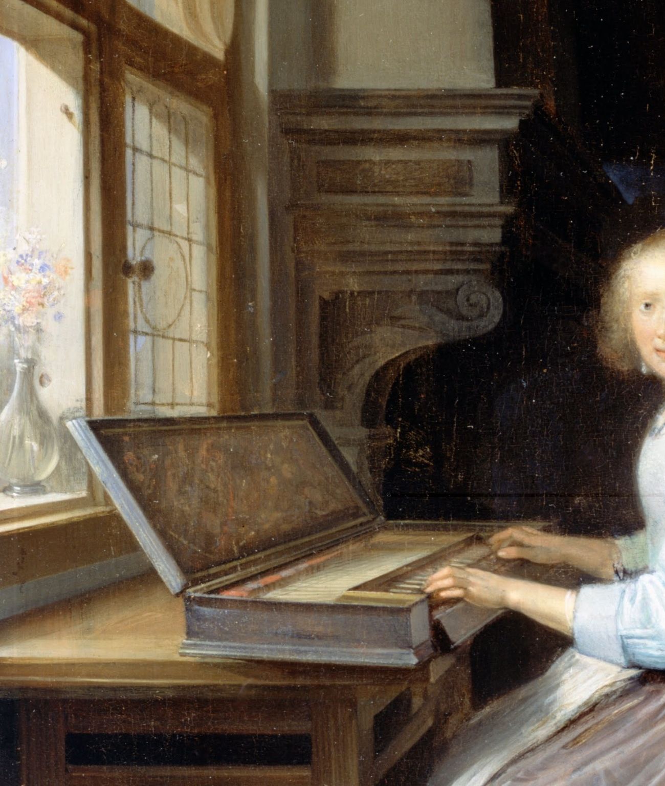 A WOMAN PLAYING A CLAVICHORD - Gerrit Dou